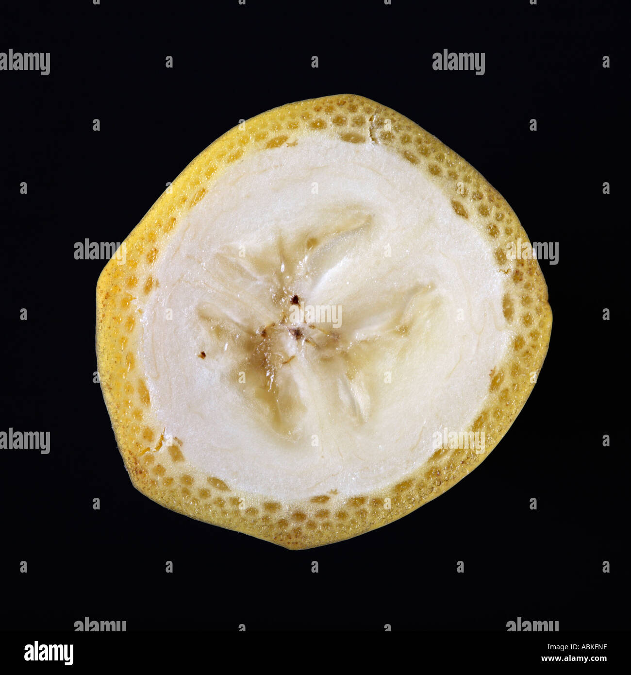 Banana slice on black background - cross section Stock Photo - Alamy
