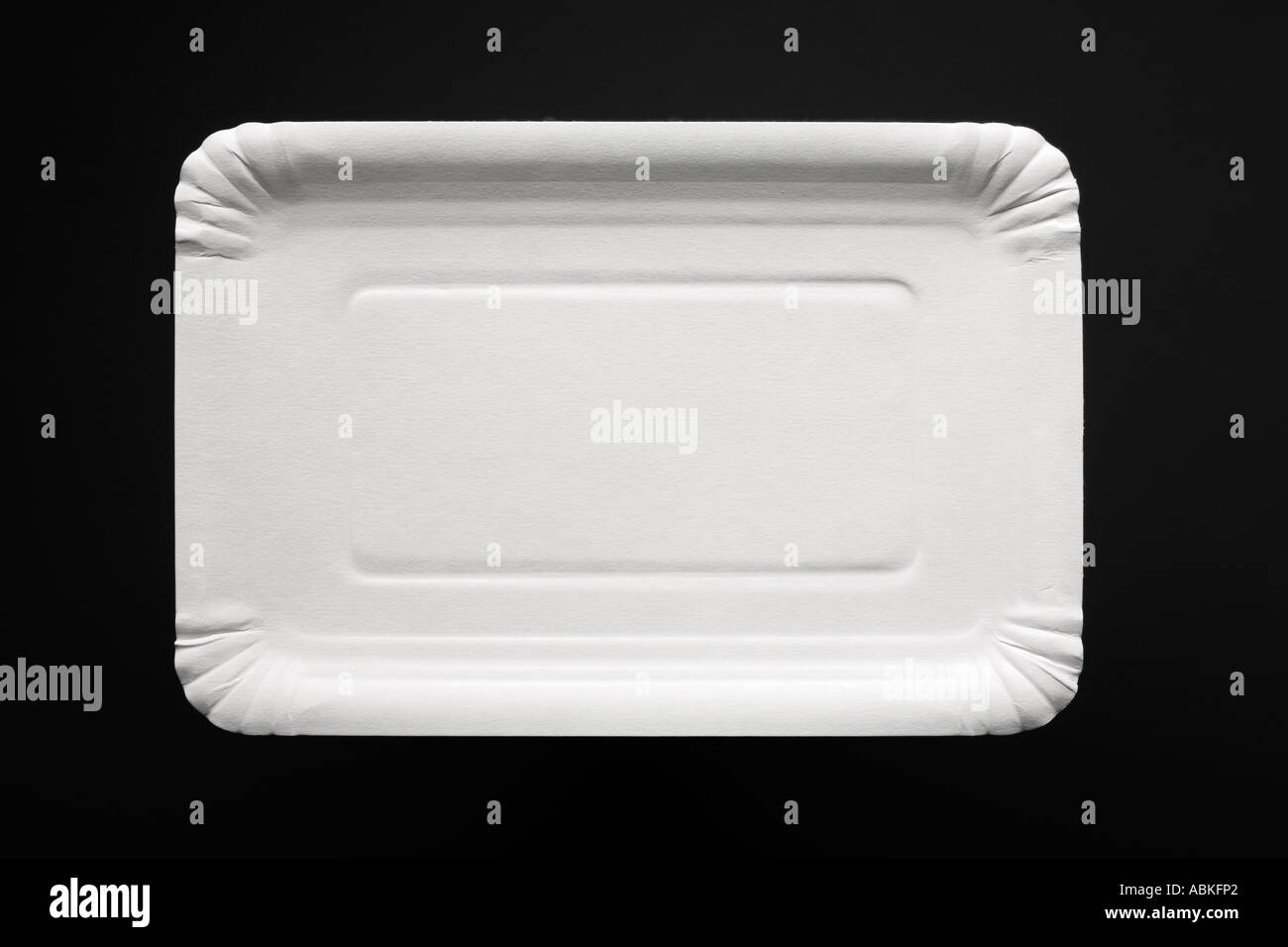 Empty white paper plate - copy space Stock Photo - Alamy