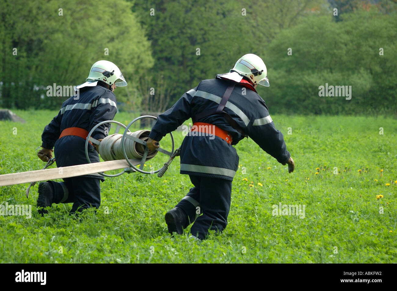 Firefighters at work Stock Photo - Alamy