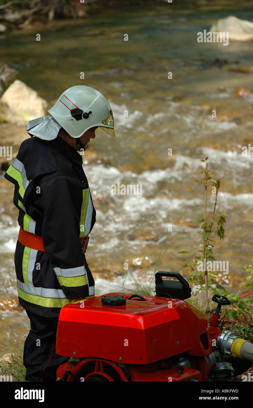 Fireman at the pump Stock Photo - Alamy