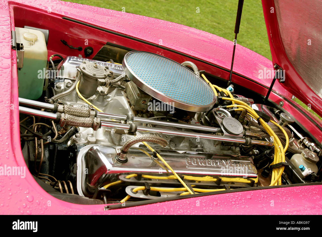 vintage car engine a close look clean brilliant red pink car open ...