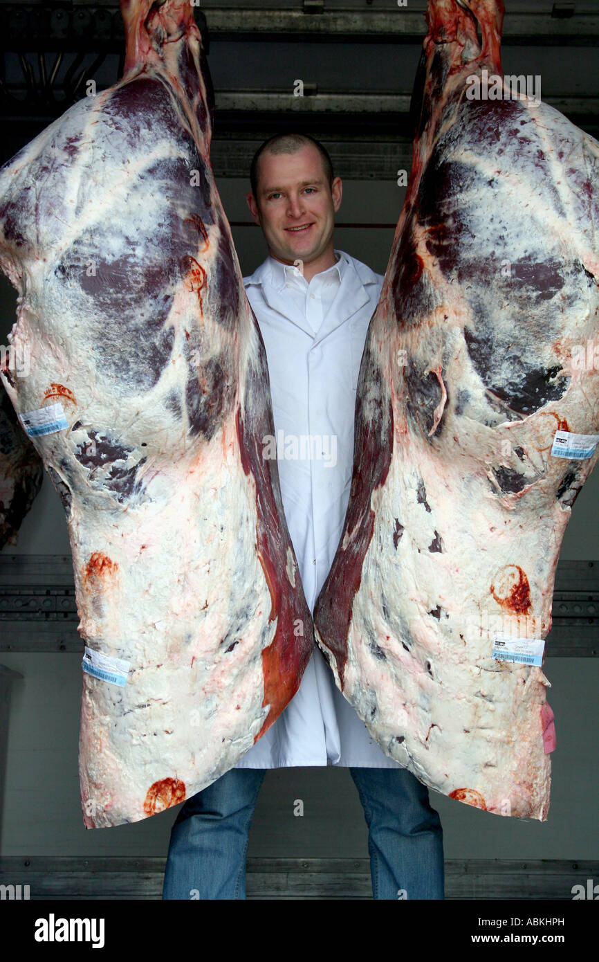 Butcher with meat Stock Photo - Alamy