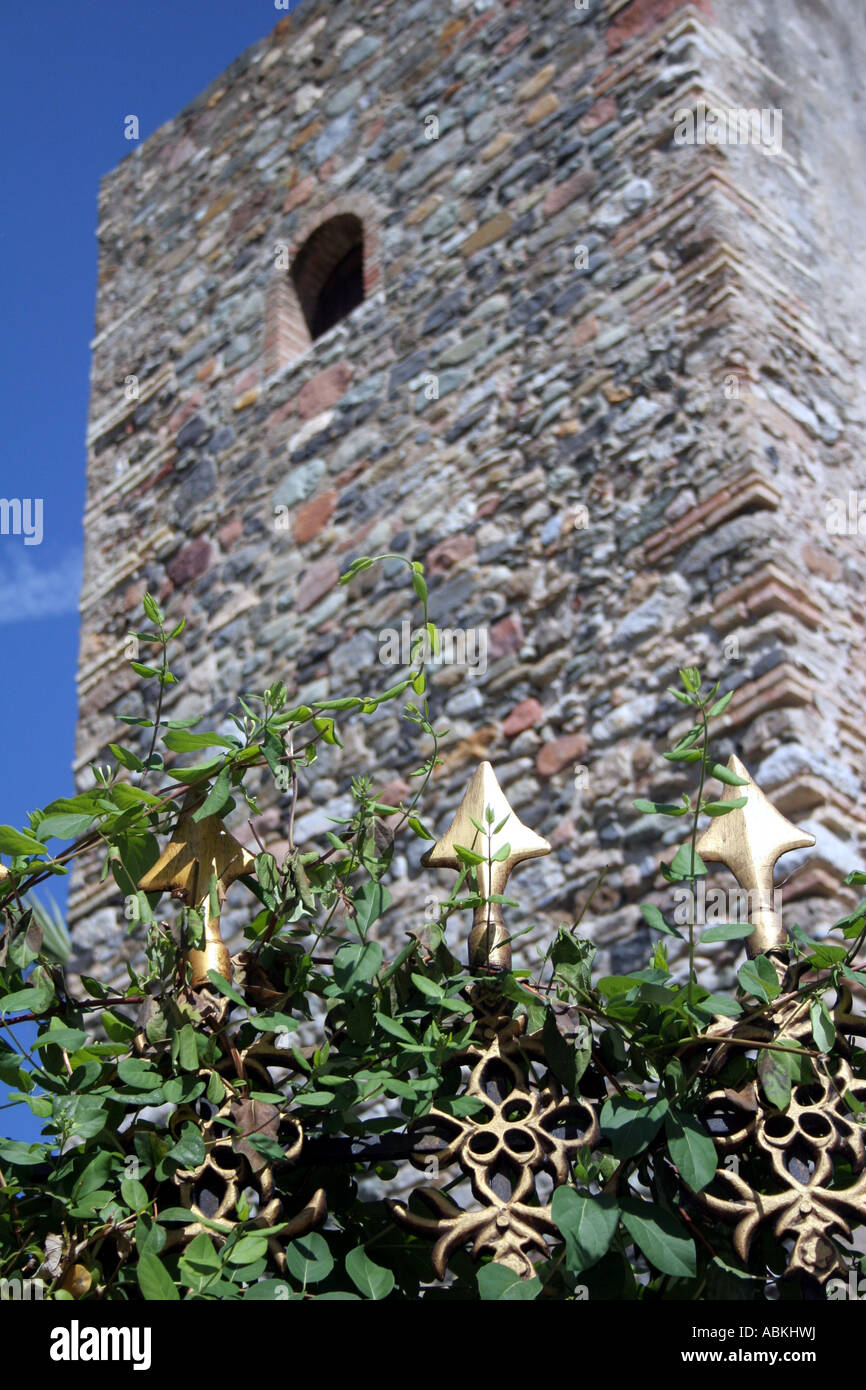 Ornate iron railings and stone tower Stock Photo - Alamy