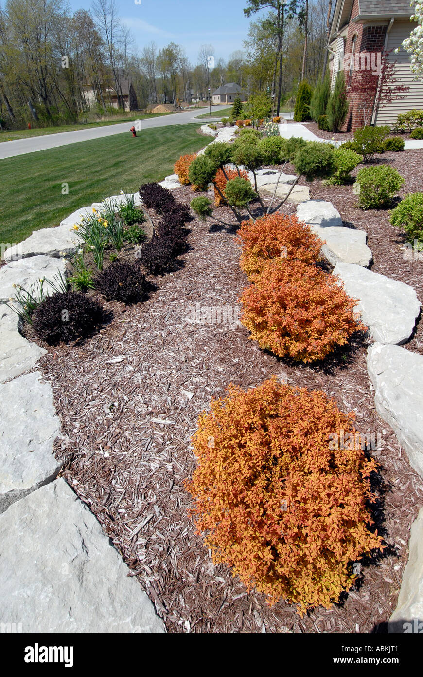 Landscaping surrounding a residential home Stock Photo - Alamy