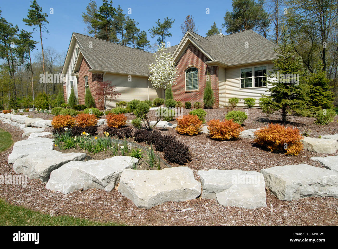 Landscaping surrounding a residential home Stock Photo - Alamy