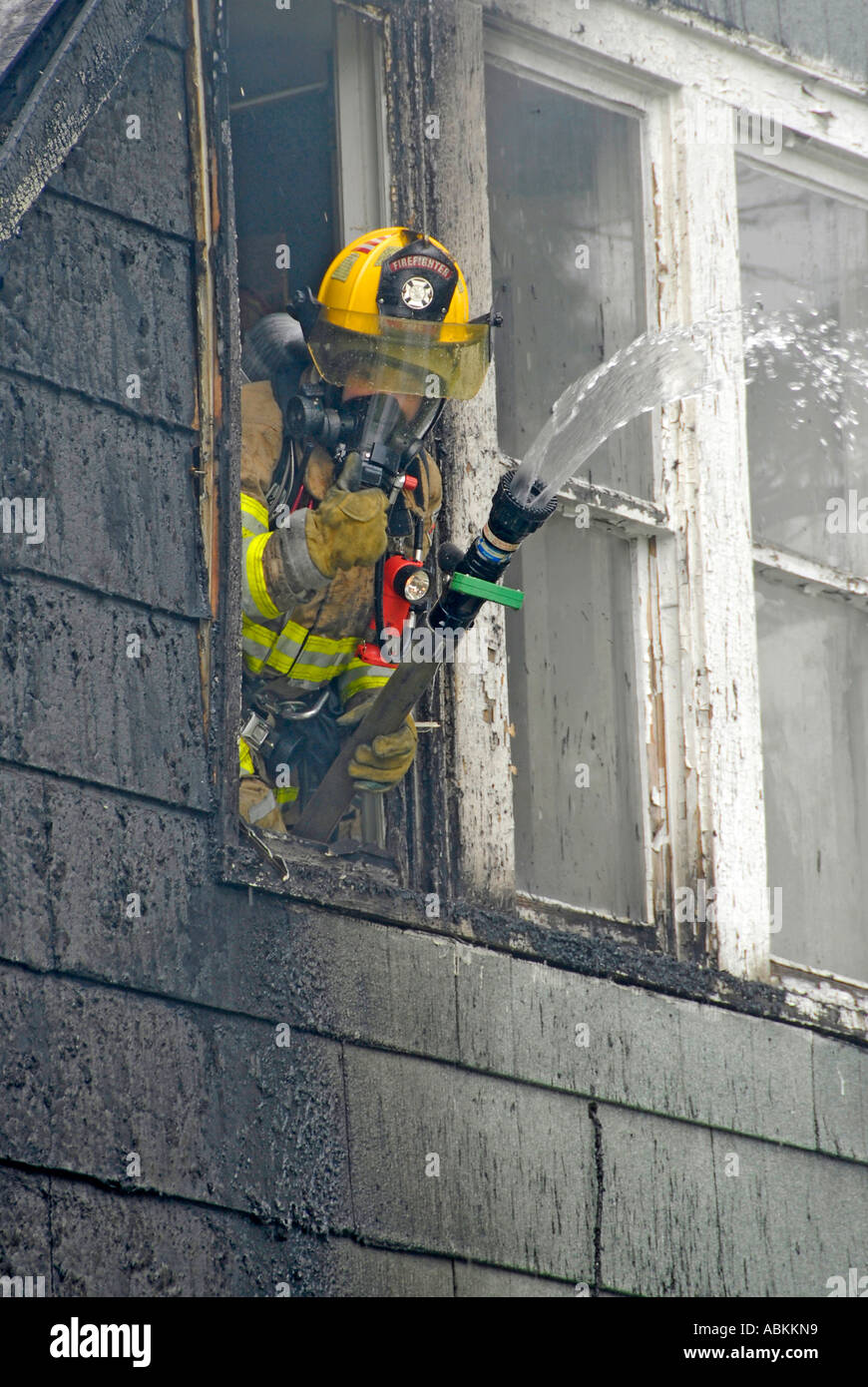 Firemen battle a residential home fire Stock Photo - Alamy