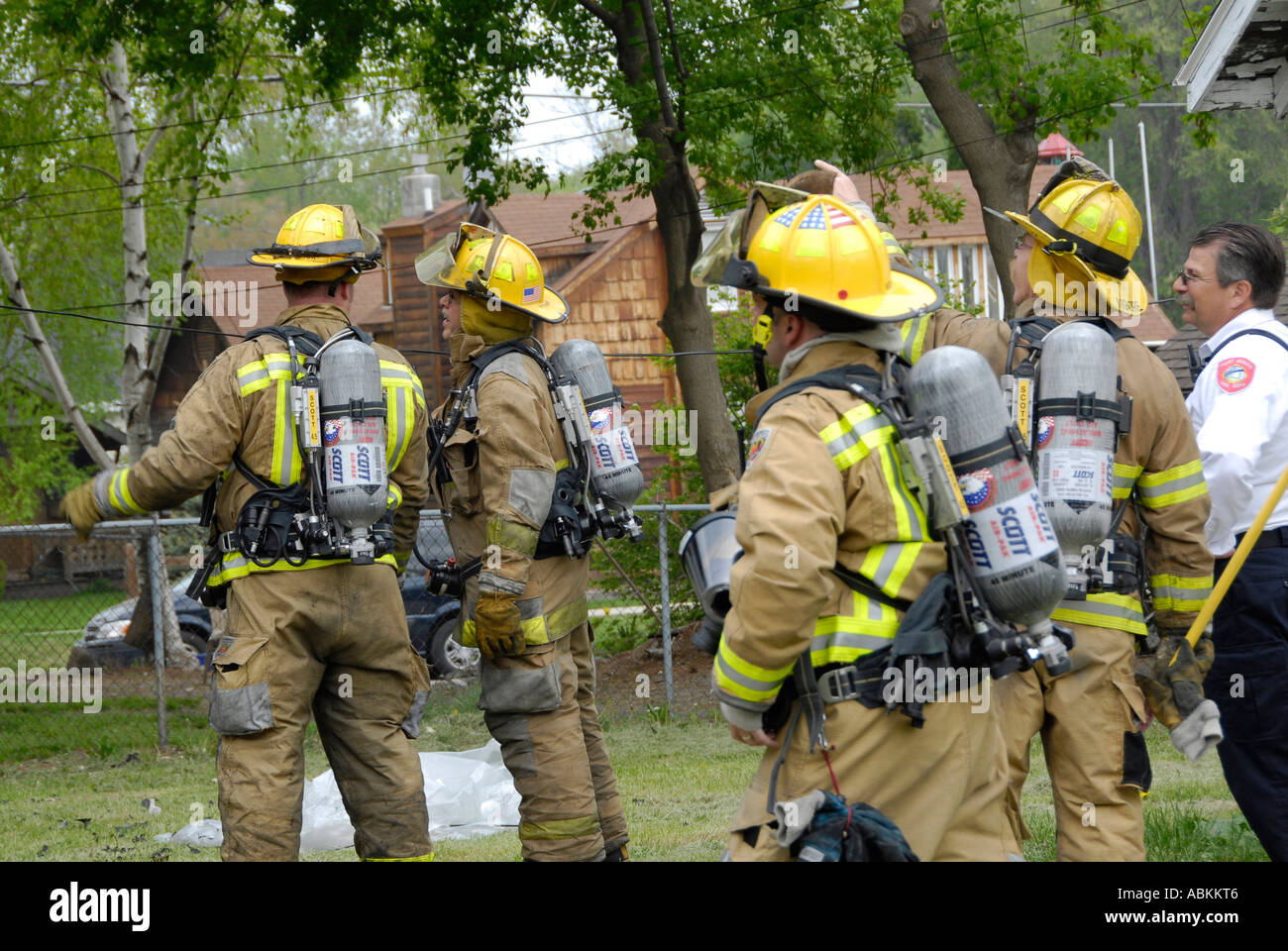 Firemen battle a residential home fire Stock Photo - Alamy