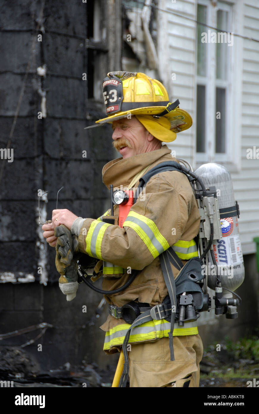 Firemen battle a residential home fire Stock Photo - Alamy