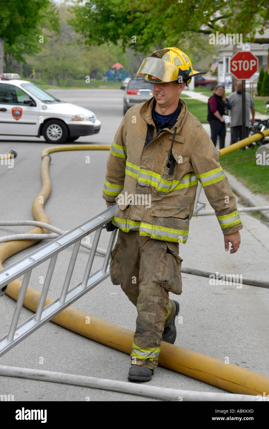 Firemen battle a residential home fire Stock Photo - Alamy
