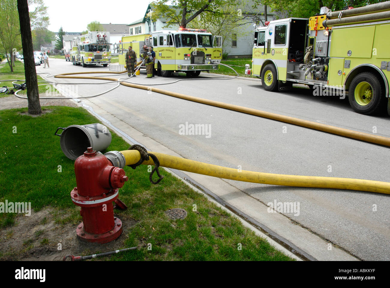 Fire hydrant fills tucks with water as Firemen battle a residential ...
