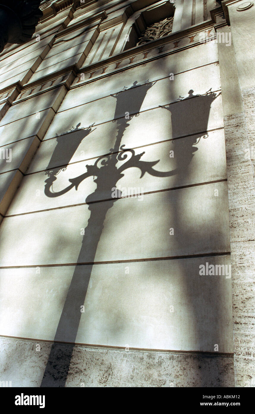 Lamp post shadow on street road in rome hi-res stock photography and ...