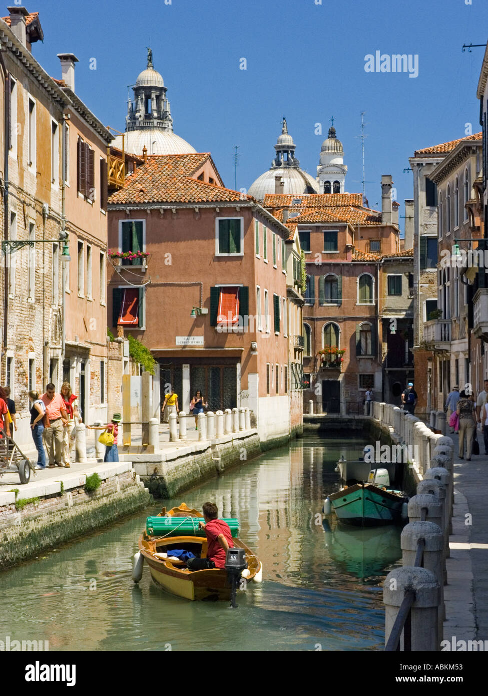 A typical scene in Venice with boats, canals, and ancient buildings ...