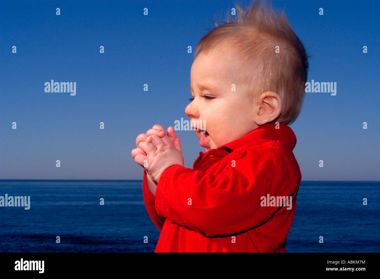 Little boy hands folded hi-res stock photography and images - Alamy