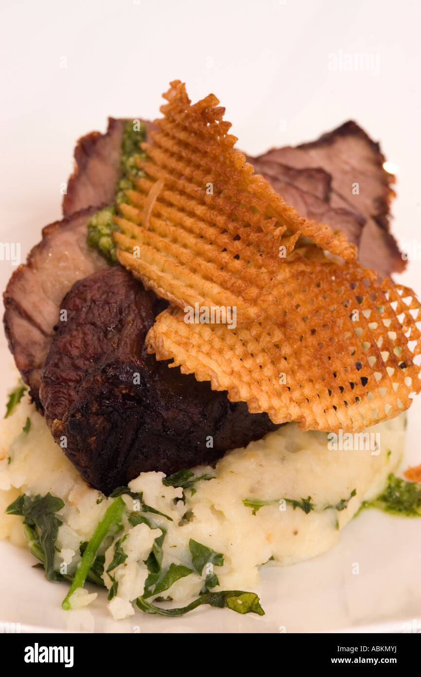 mashed potato topped with crisps and roast beef Stock Photo - Alamy