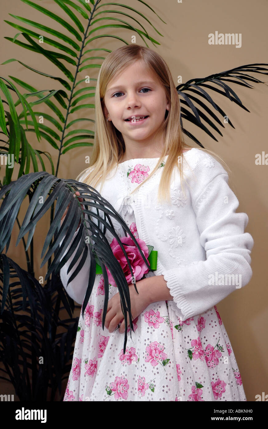 Portrait of 8 year old female child in dress Stock Photo - Alamy