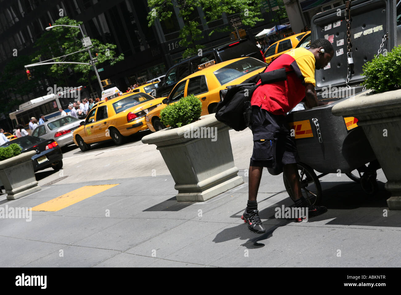 Manhattan, New York on Sixth Avenue with a single male in DHL uniform ...