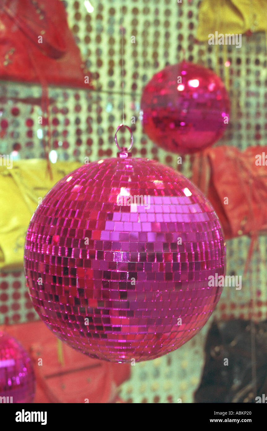 purple glitter ball in shop window display Stock Photo - Alamy