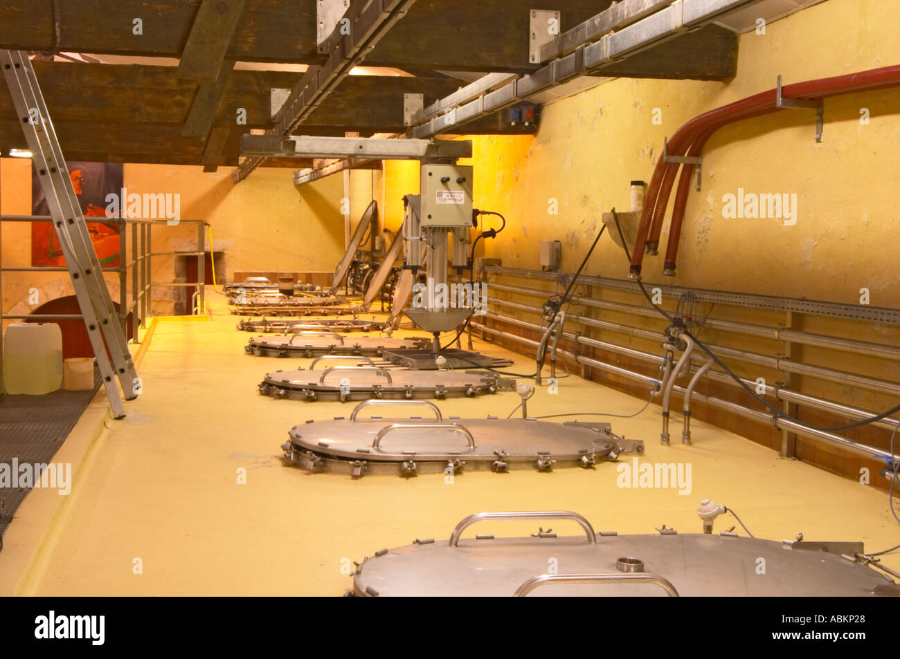 The concrete fermentation vats seen from above with the machine to do ...