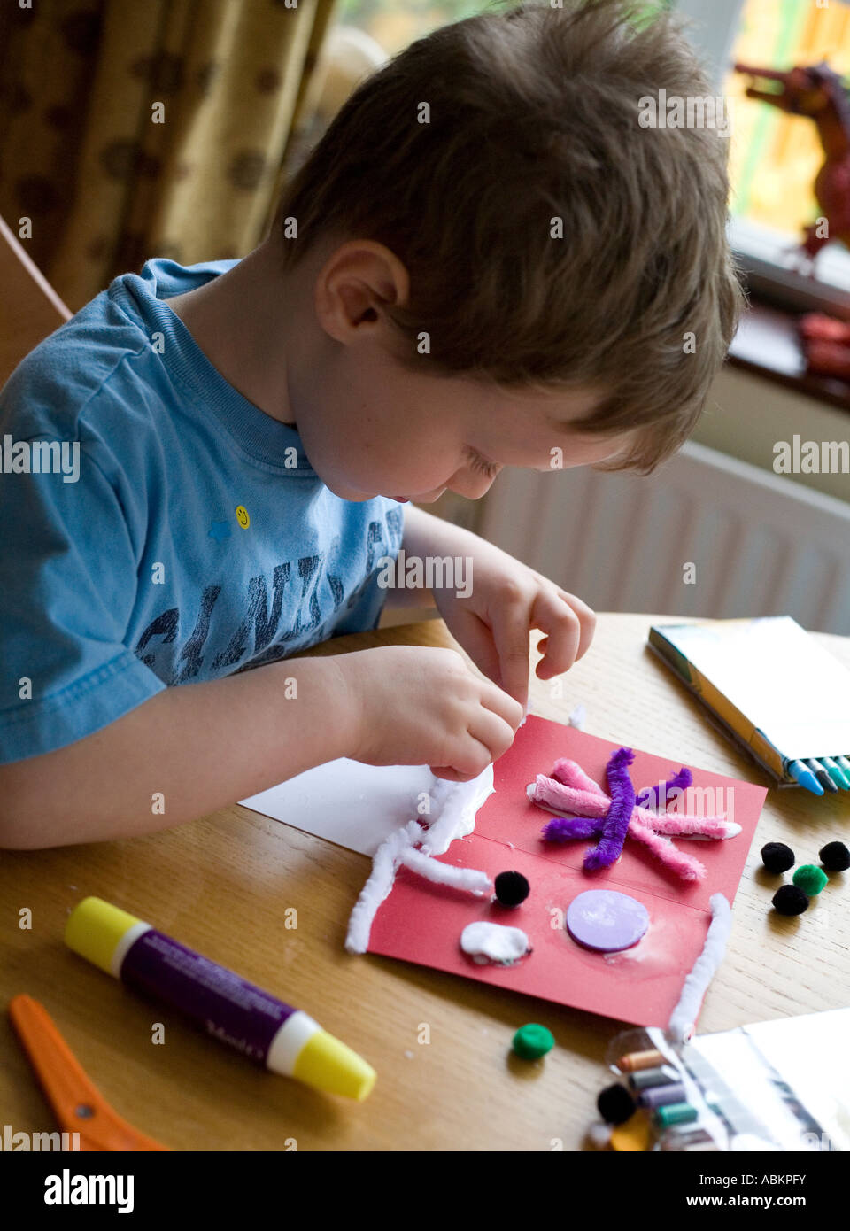 Boy making card Stock Photo - Alamy