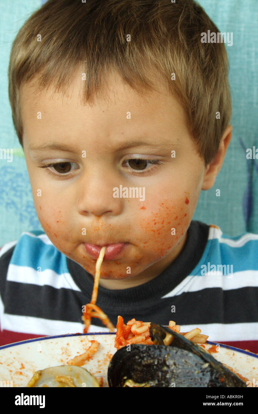 Boy Eating Spaghetti Stock Photo - Alamy