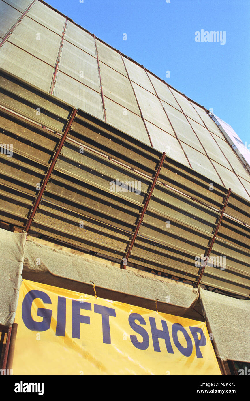 gift shop sign with scaffolding Stock Photo - Alamy