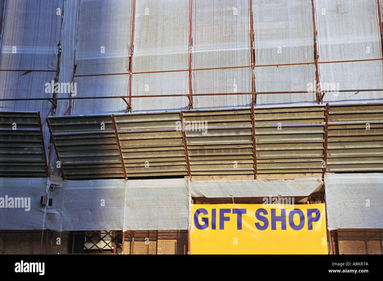 gift shop sign with scaffolding Stock Photo - Alamy