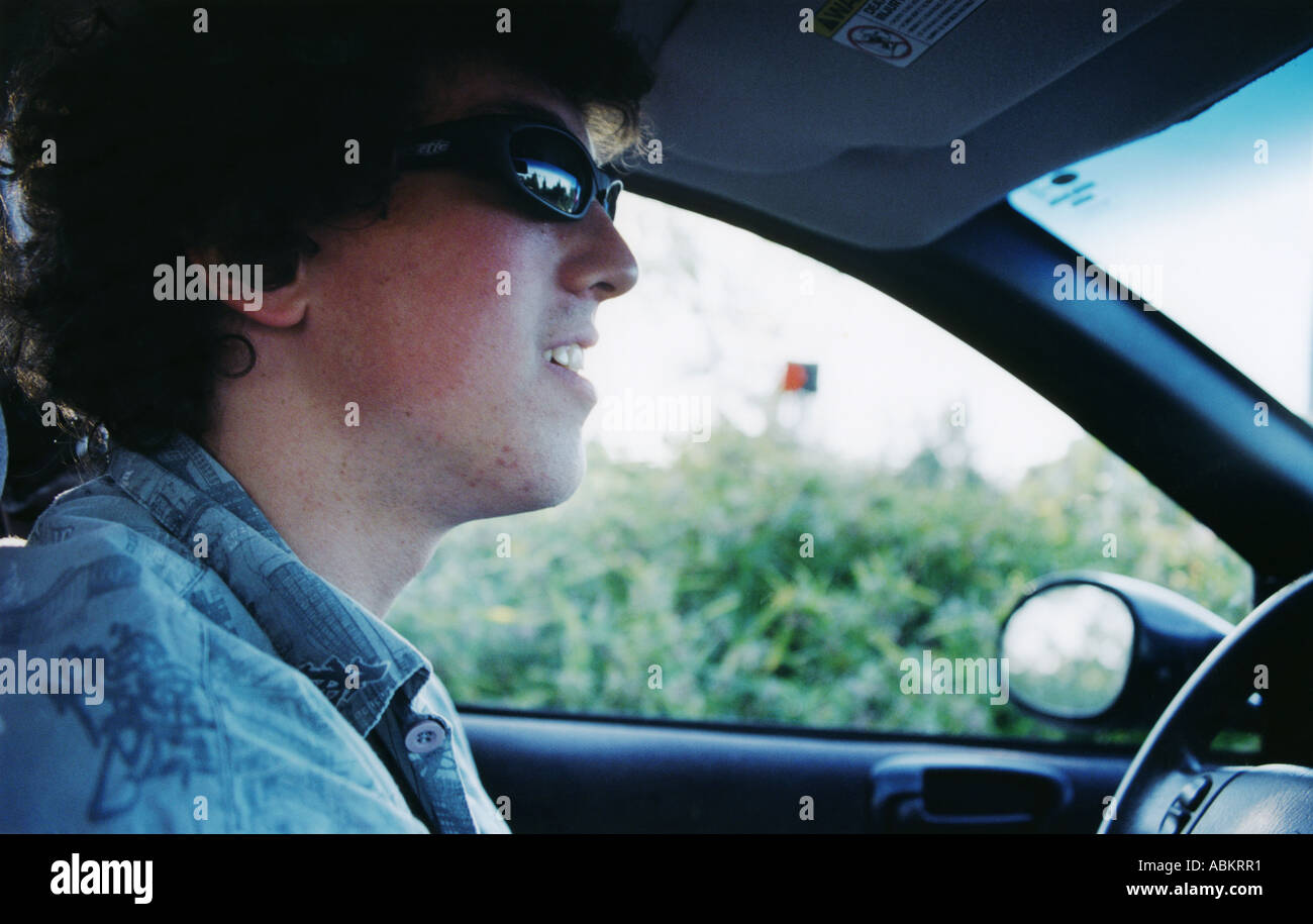 Young man driving a car Stock Photo - Alamy