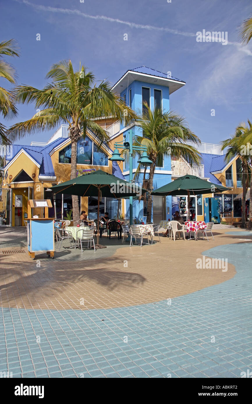 A photo of an outdoors plaza with colorful tropical retail buildings ...