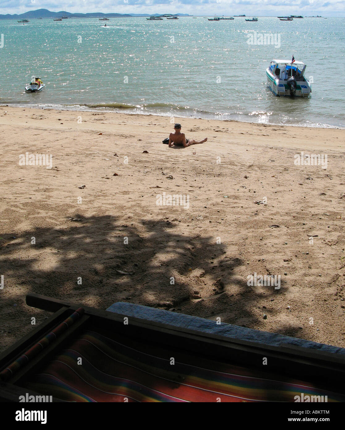 "single male alone sunbathing on the beach in Pattaya Thailand Stock ...