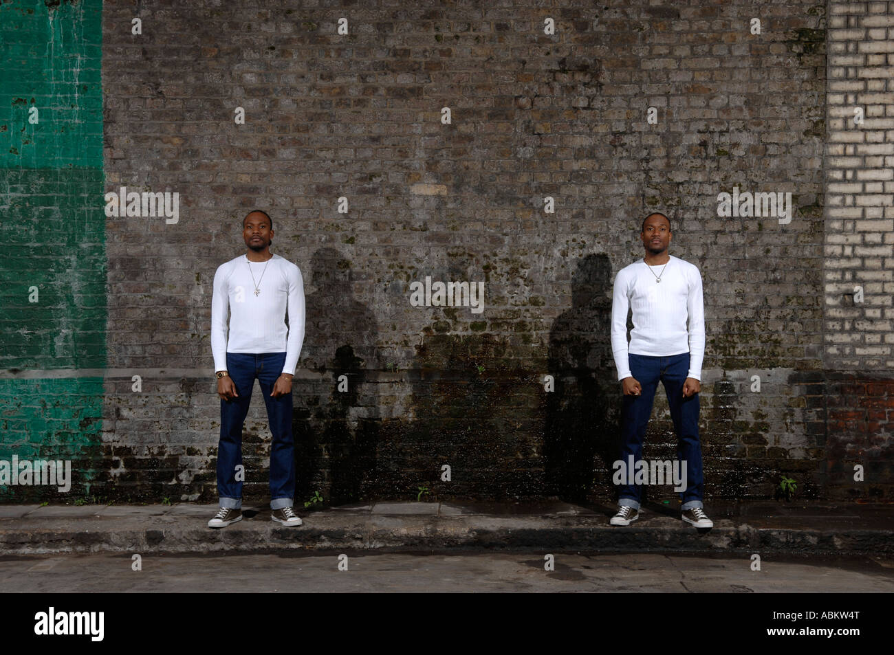Identical twins different hi-res stock photography and images - Alamy
