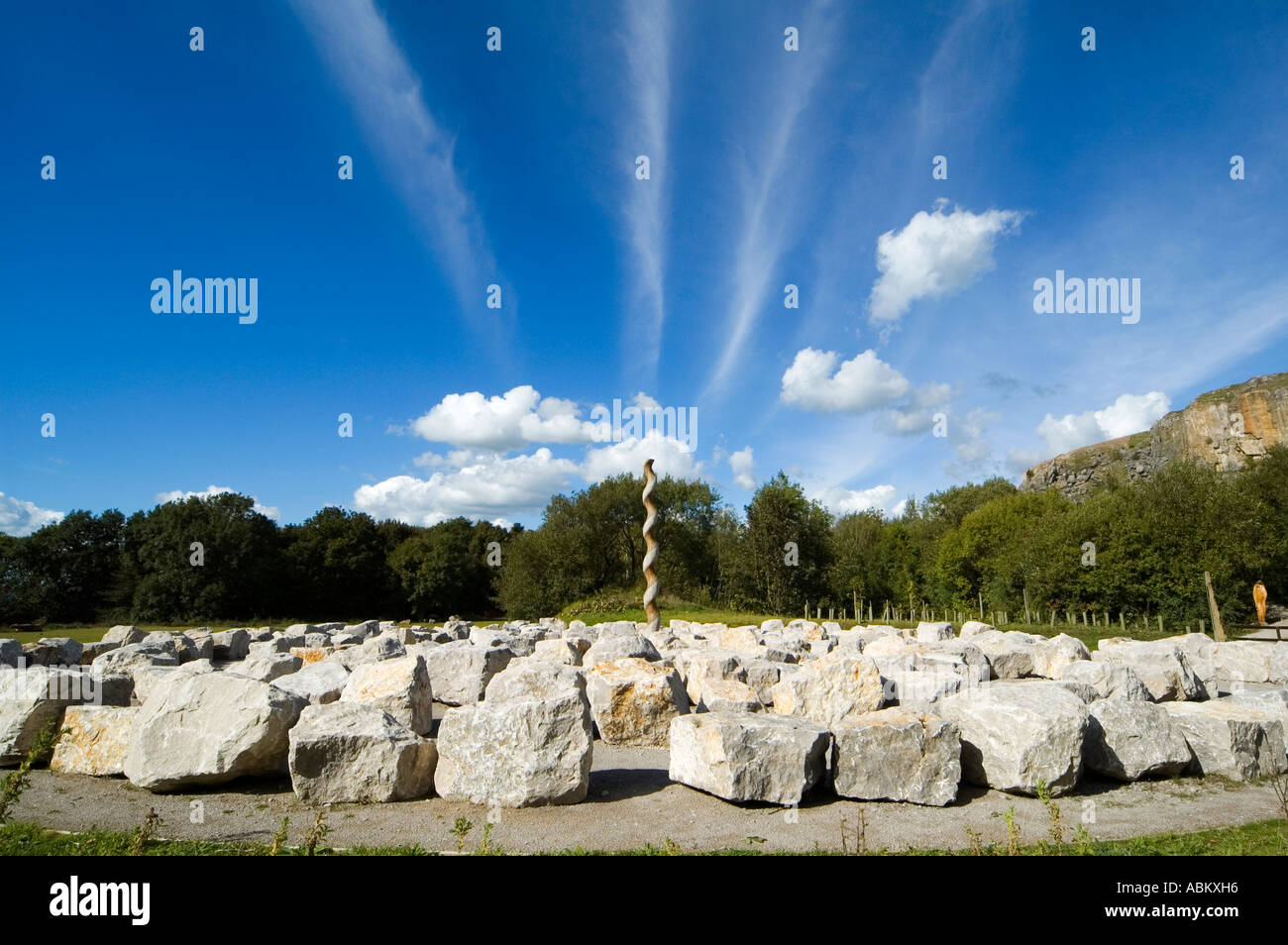 The Labyrinth sculpture, with three lines of cirrus cloud, Crich ...
