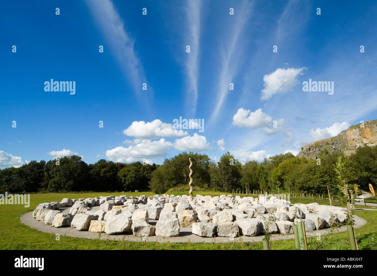 The Labyrinth sculpture, with three lines of cirrus cloud, Crich ...