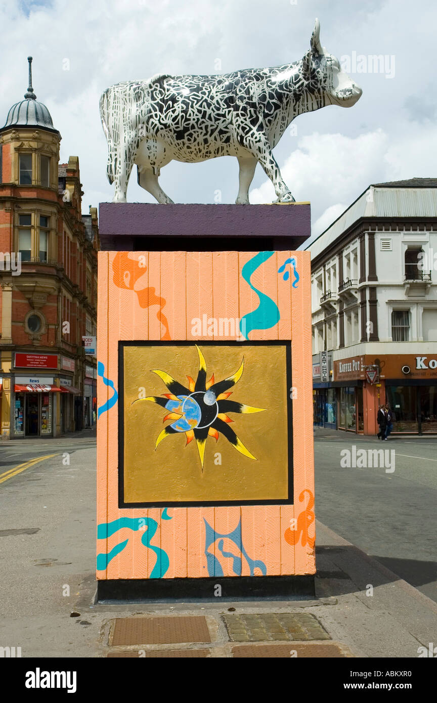 An exhibit of the 2004 Cow Parade, Manchester, England, UK. Above a ...