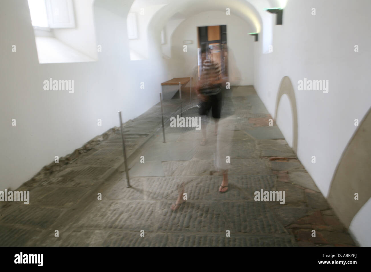 Ghost like people walking through a corridor Stock Photo - Alamy