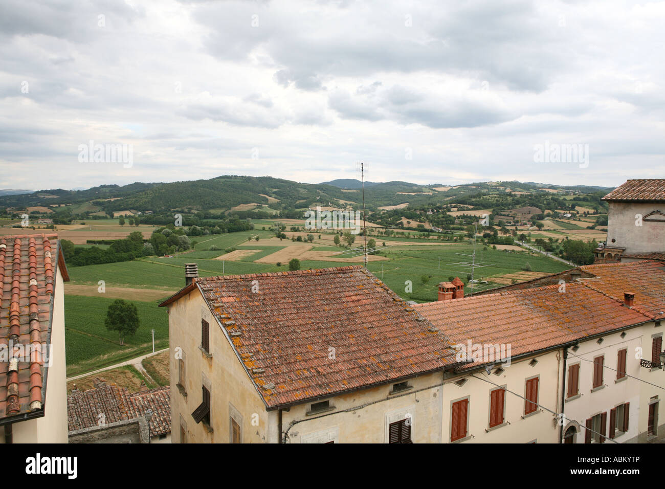 A birds eye view over some traditional italian buildings and farmland ...