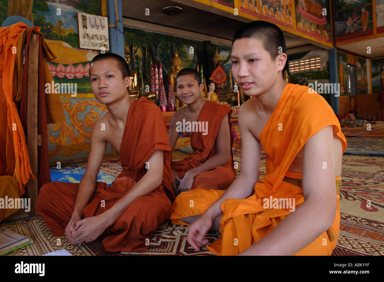 Young Buddhist monks relax in their temple at Pakse, southern Laos ...