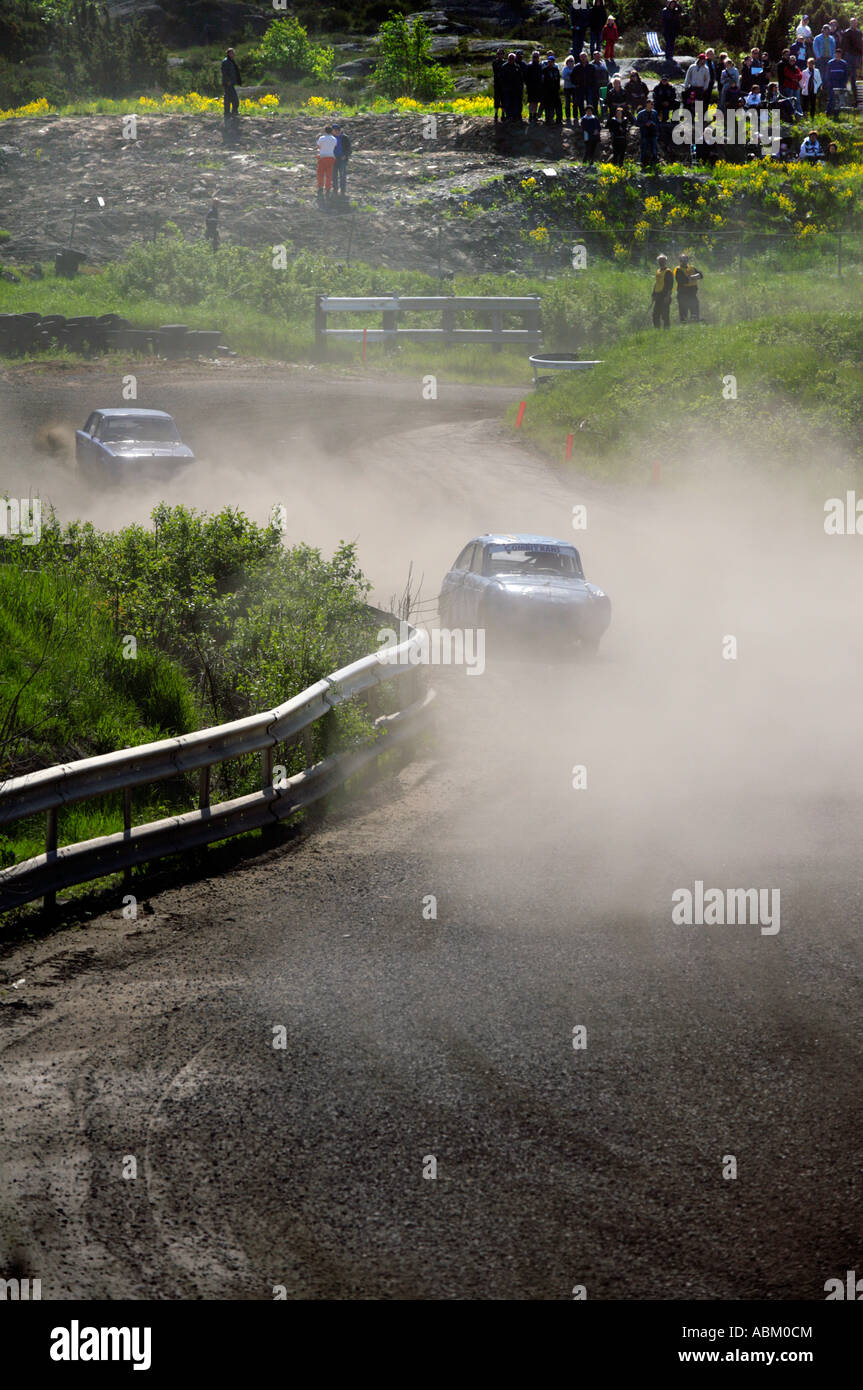 Trailing dust clouds Folkracing banger racing cars speed down ...