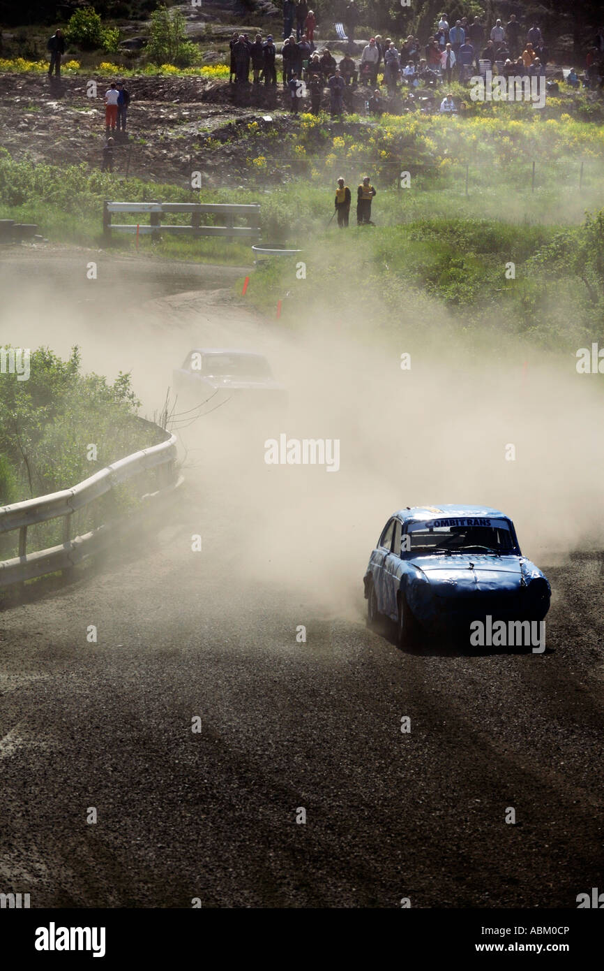 Trailing clouds of dust Folkracing banger racing cars speed down ...