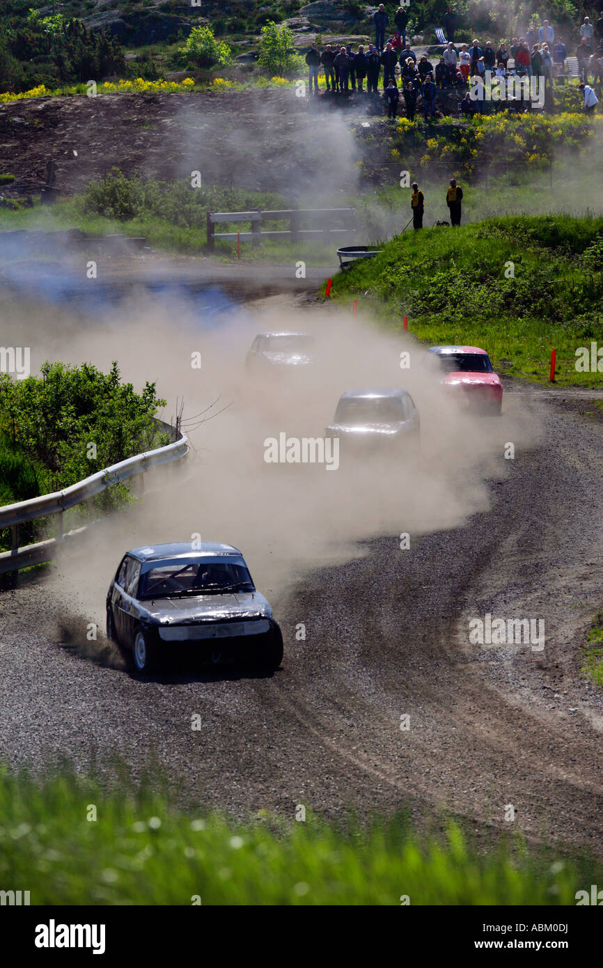 Cars speed through countryside raising dust clouds at Torslanda ...