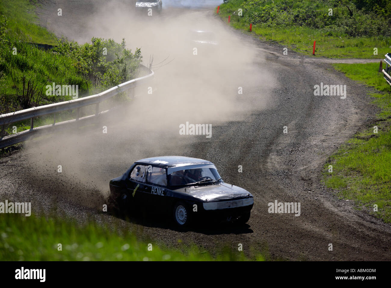 Cars speeding through a countryside raising clouds of dust at Torslanda ...