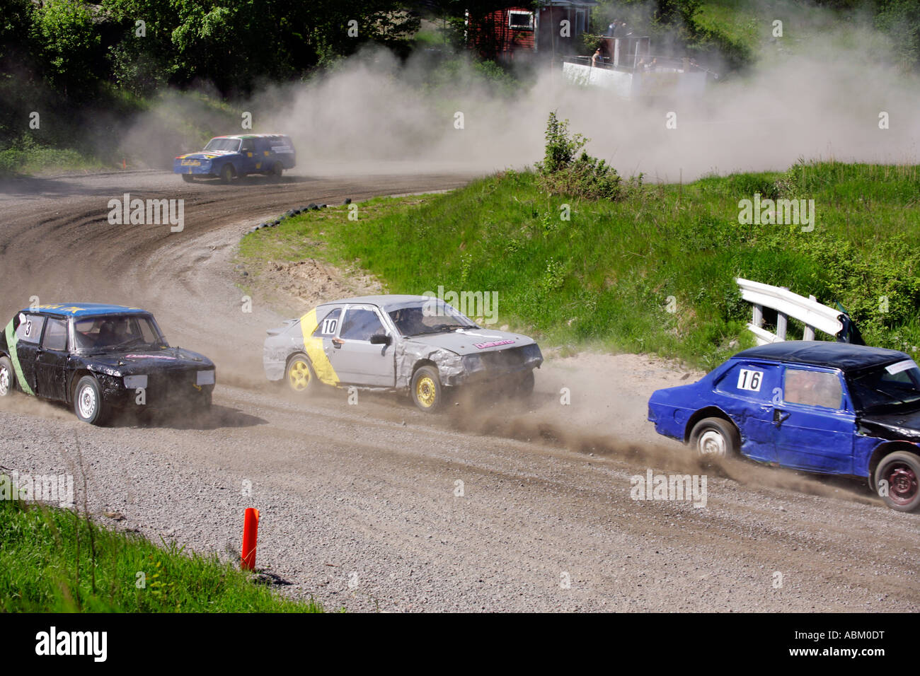Raising clouds of dust Folkrace banger racing Cars curve through ...