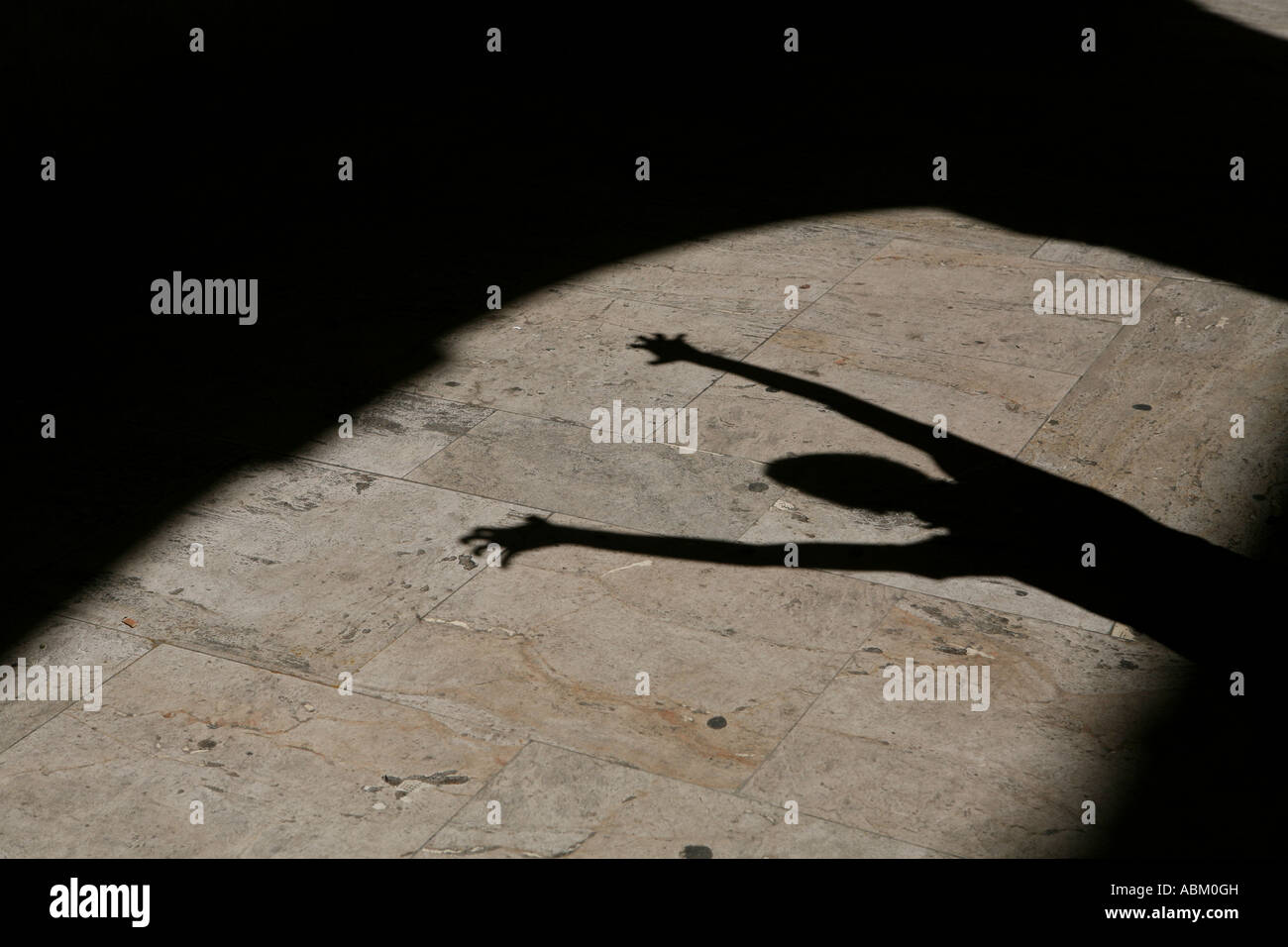 A sinister shadow of a person on a floor Stock Photo - Alamy