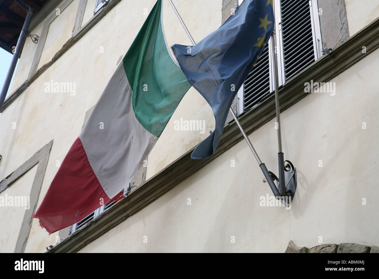 An italian flag on a wall of a traditional building in Arezzo, Tuscany ...