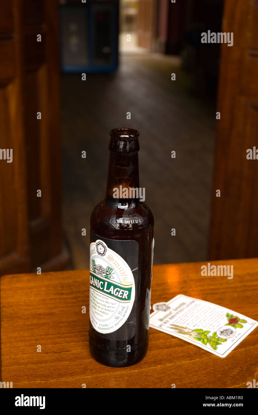 A bottle of lager and an open door Stock Photo - Alamy