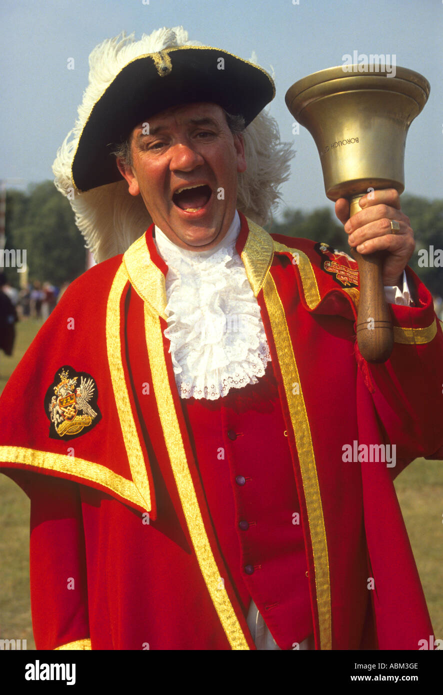 London Town Crier in full regalia rings his bell for attention as he ...