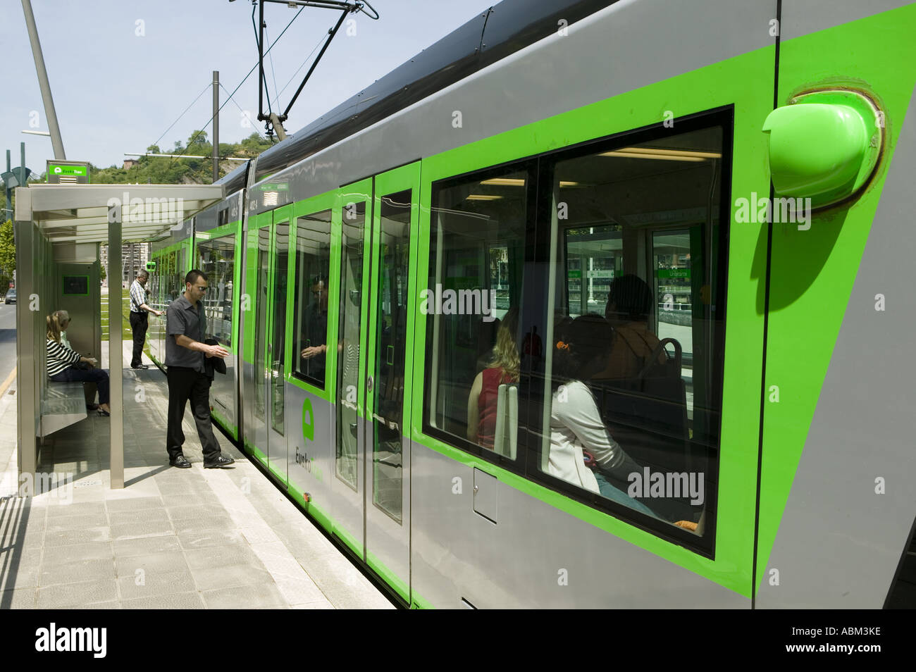 Passengers boarding EuskoTran tram at Urbitarte station, Bilbao, Pais Vasco (Basque Country ...