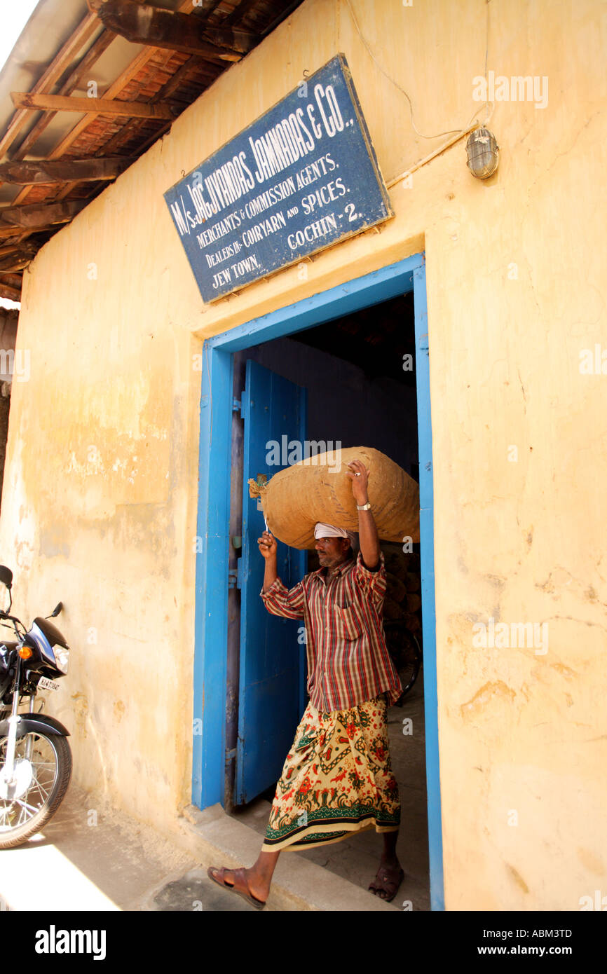 Spice Trader carrying sack from store, Fort Cochin, Kerala, South India ...