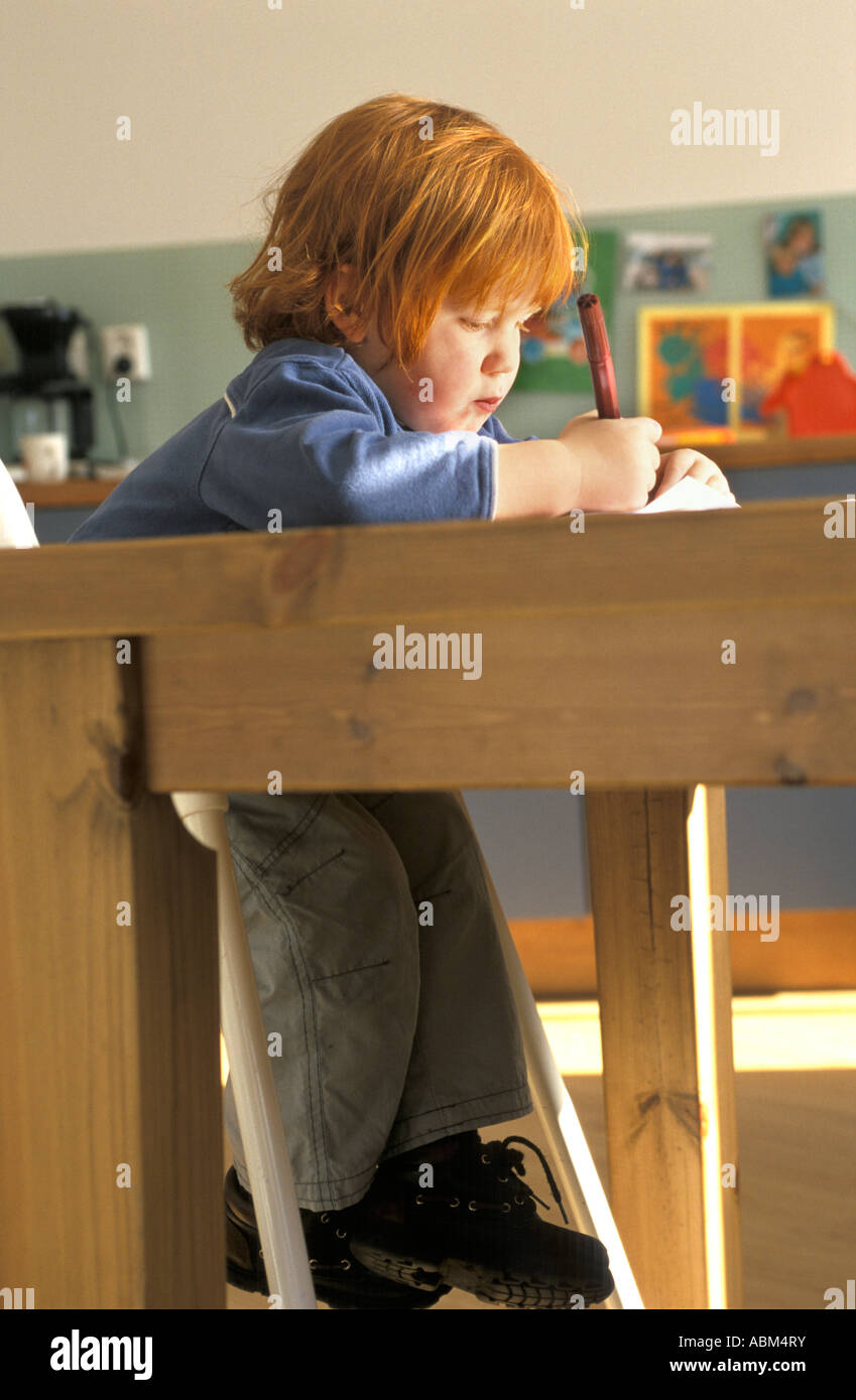 Little boy is making a drawing Stock Photo - Alamy