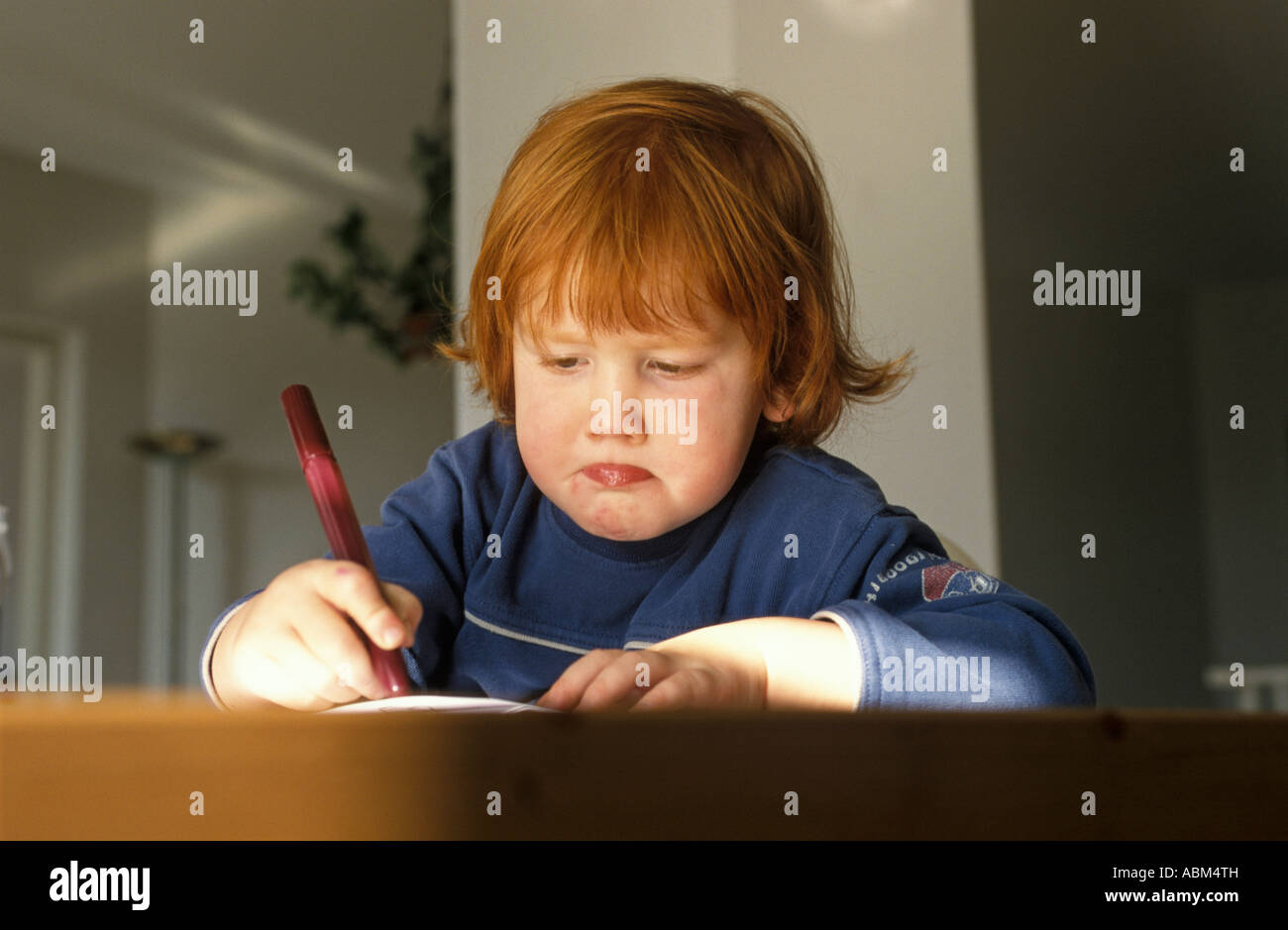 Little boy is making a drawing Stock Photo - Alamy