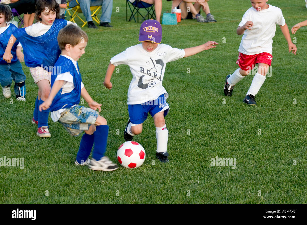 Boys and girls playing soccer at school hi-res stock photography and ...